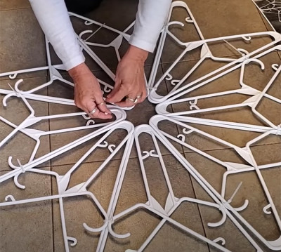 How To Make A Snowflake Using Plastic Hangers - DIY Joy