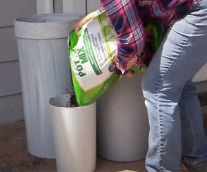 How to Turn Trash Cans Into Tall Planters - DIY Joy