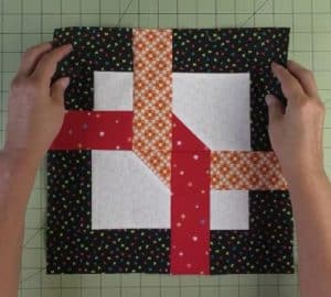 How to Make Loop the Loop Jelly Roll Quilt Block - DIY Joy