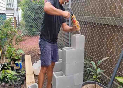 Easy DIY Cinder Block Plant Shelf - DIY Joy